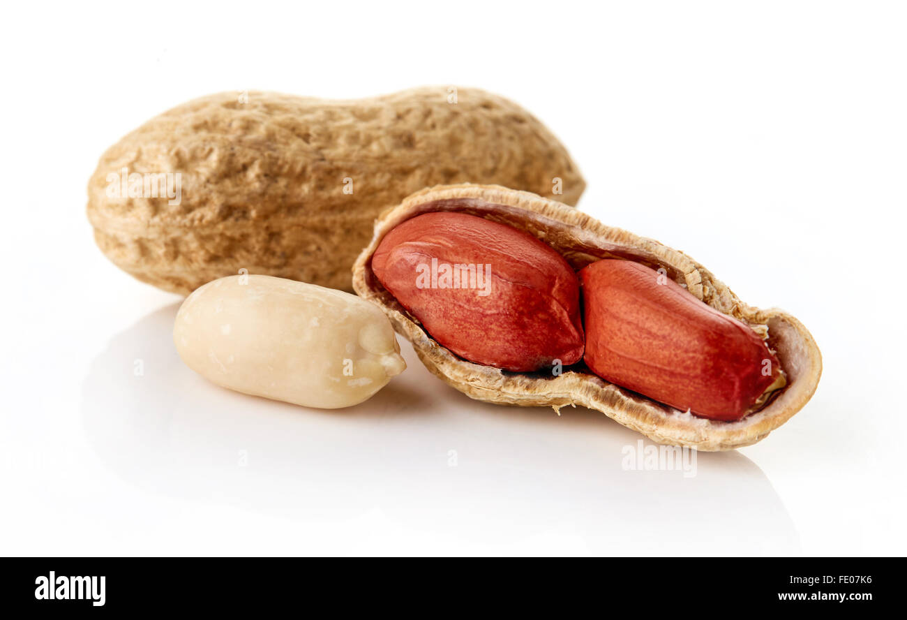 Cracked peanuts on white background Stock Photo - Alamy