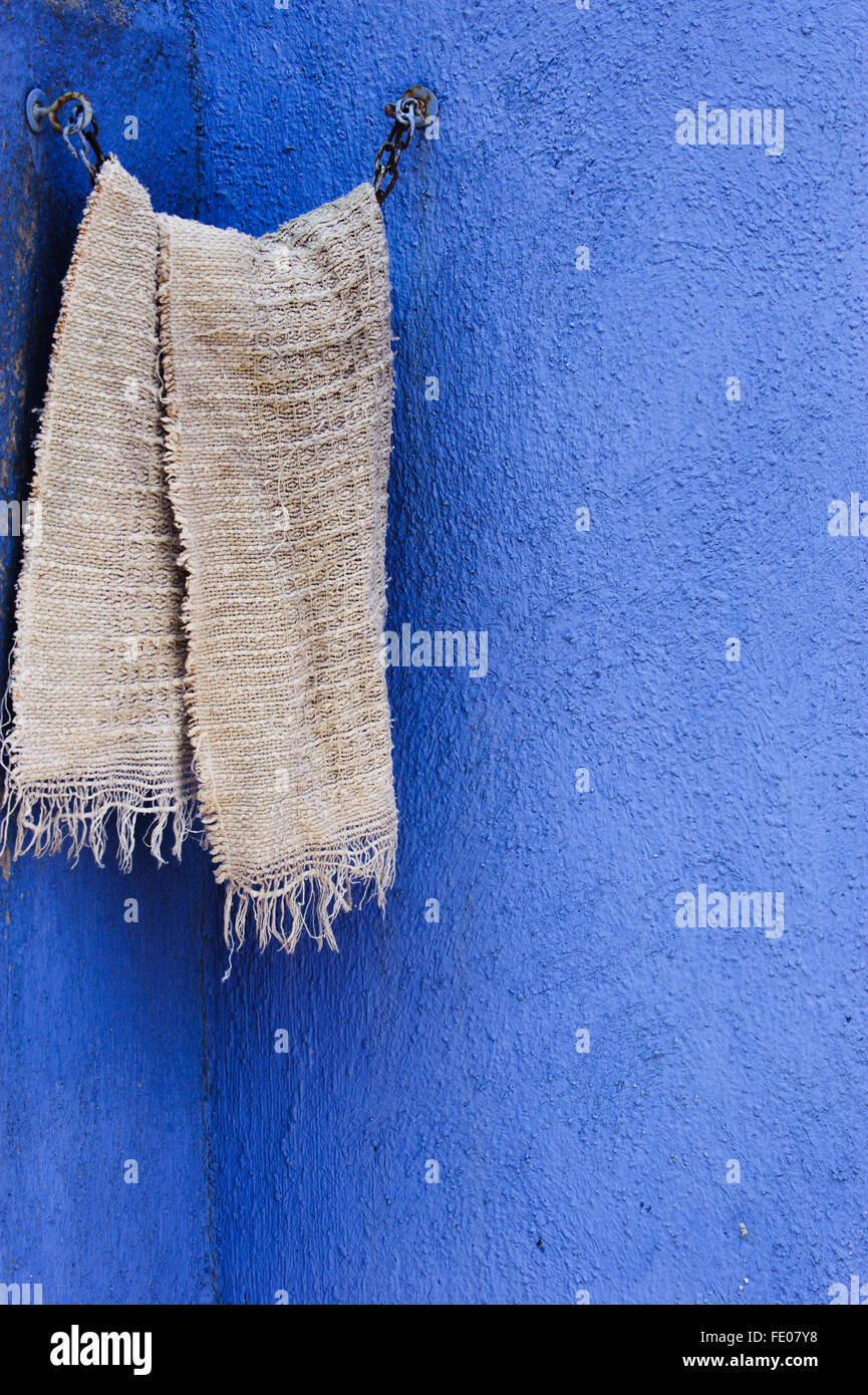 White Rag hanging against Blue Wall Stock Photo - Alamy