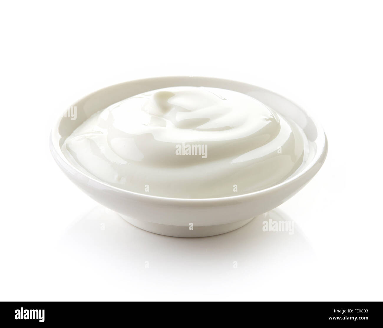 Bowl of cream on white background Stock Photo - Alamy