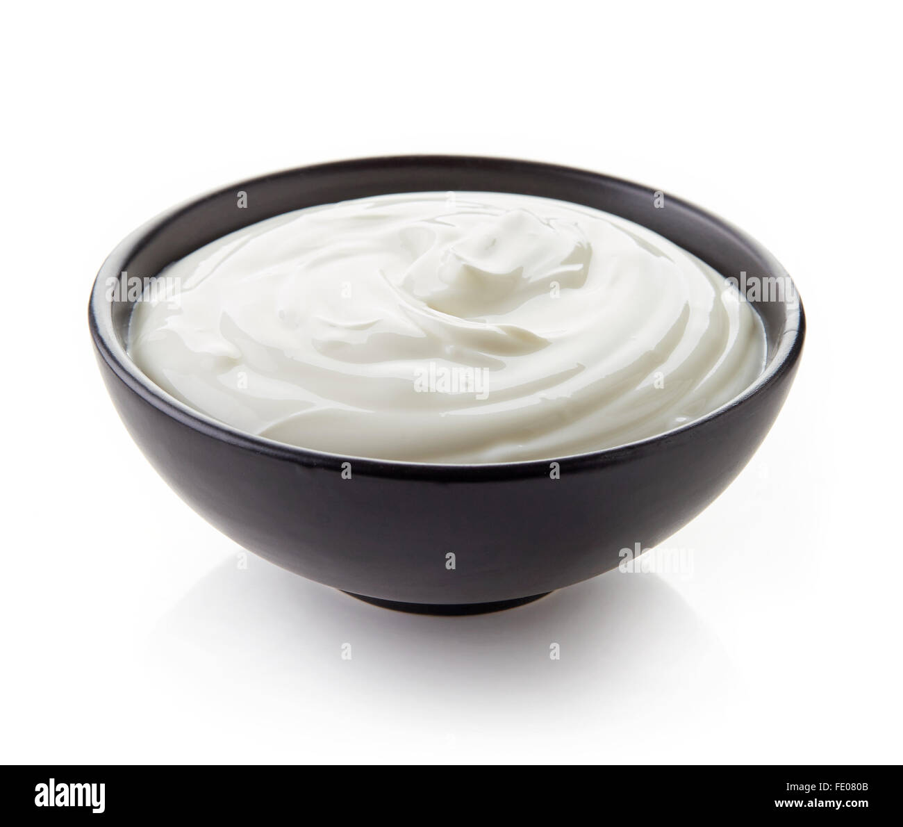 Bowl of cream on white background Stock Photo - Alamy