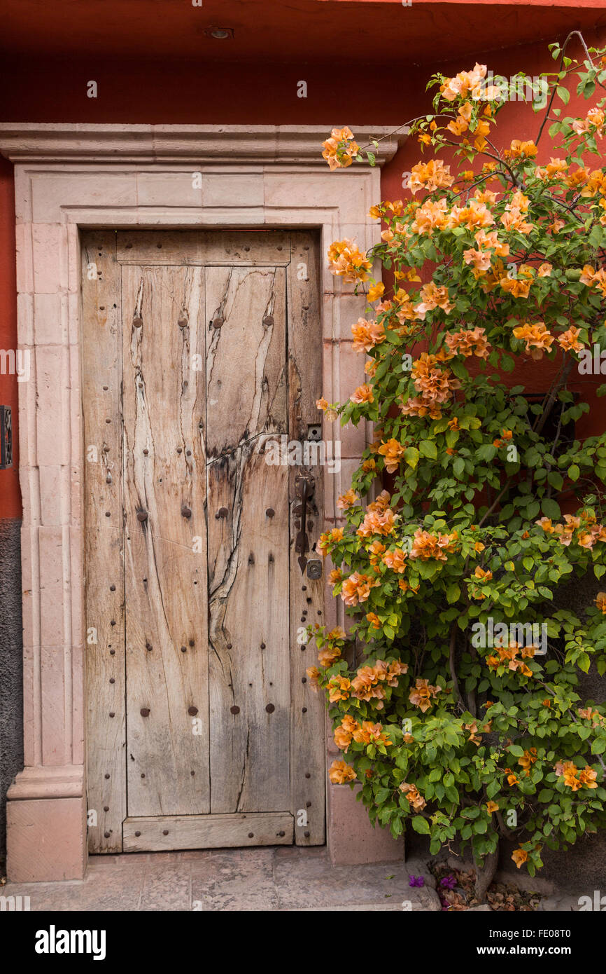 A traditional Spanish colonial hacienda style painted wooden door on a ...