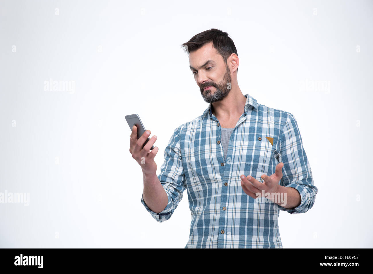 Man holding smartphone isolated on a white background Stock Photo - Alamy