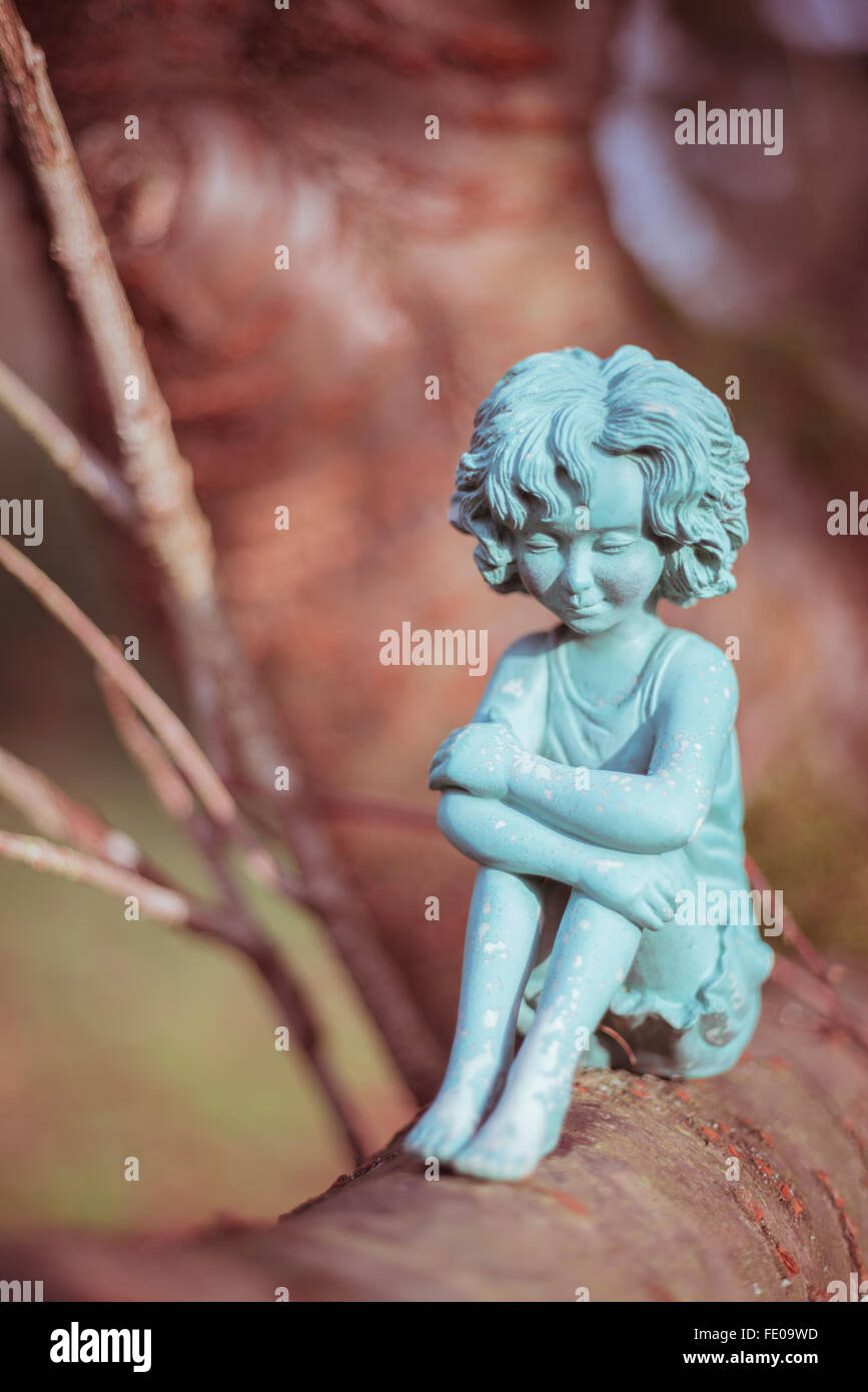 Girl sitting on statue hi-res stock photography and images - Alamy