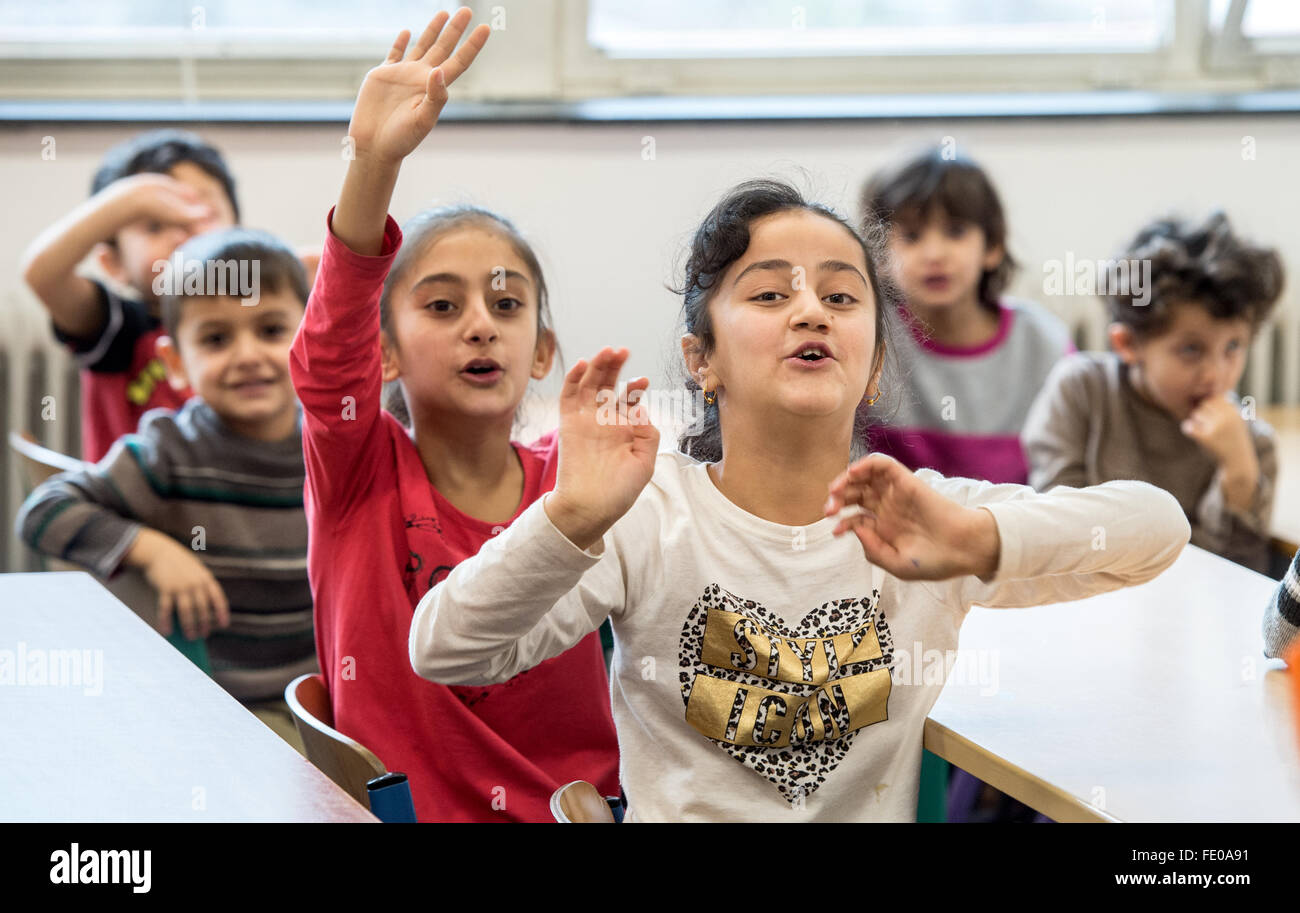 Refugee children sitting in a classroom in a former Neckermann building ...