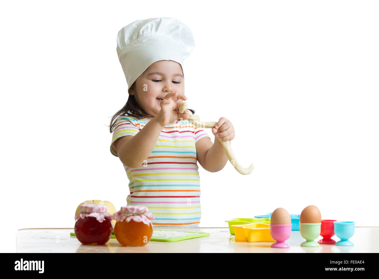 Little child girl cook playing with dough Stock Photo - Alamy