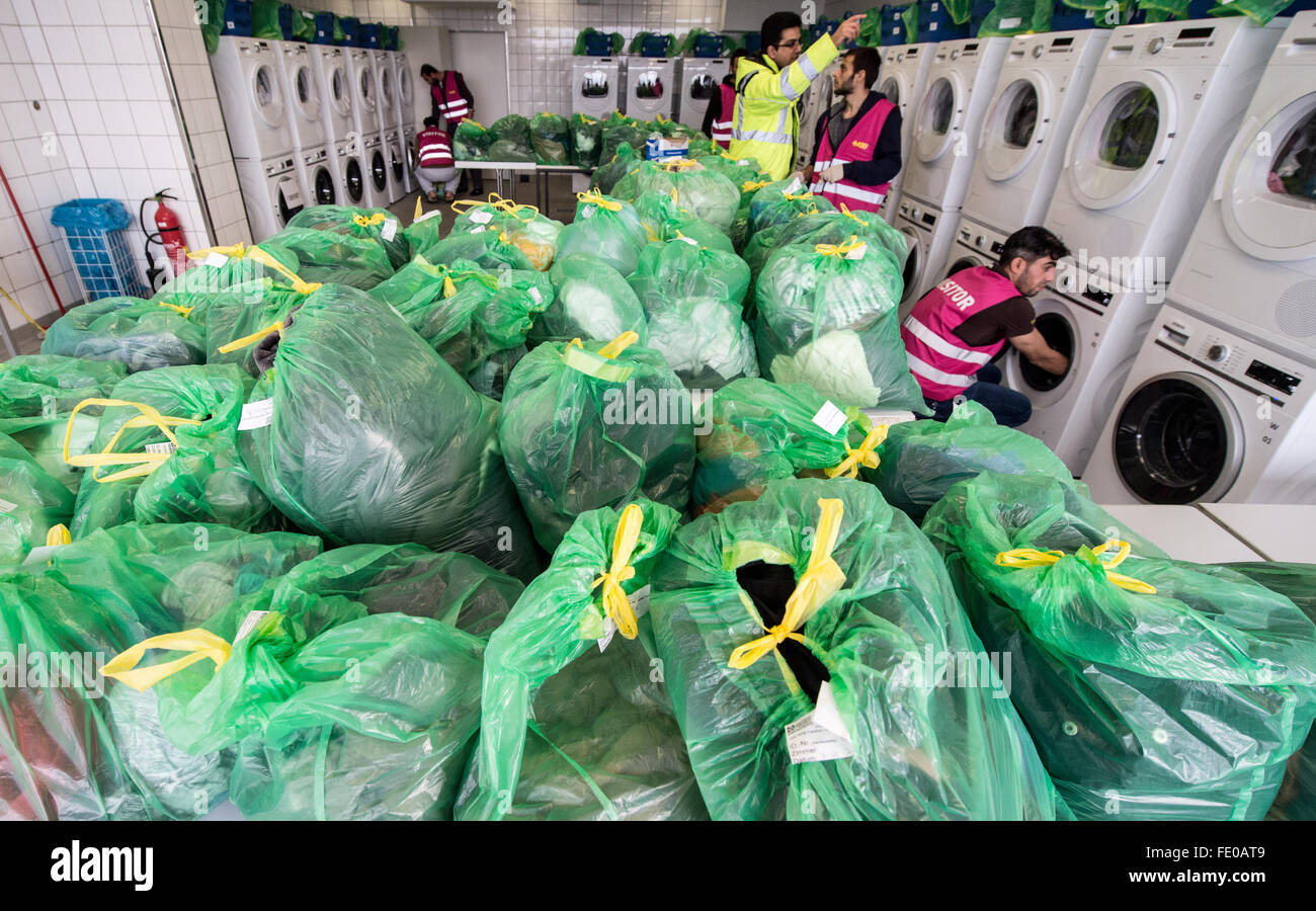 Sacks of washing piled up in the laundry in a former Neckermann ...