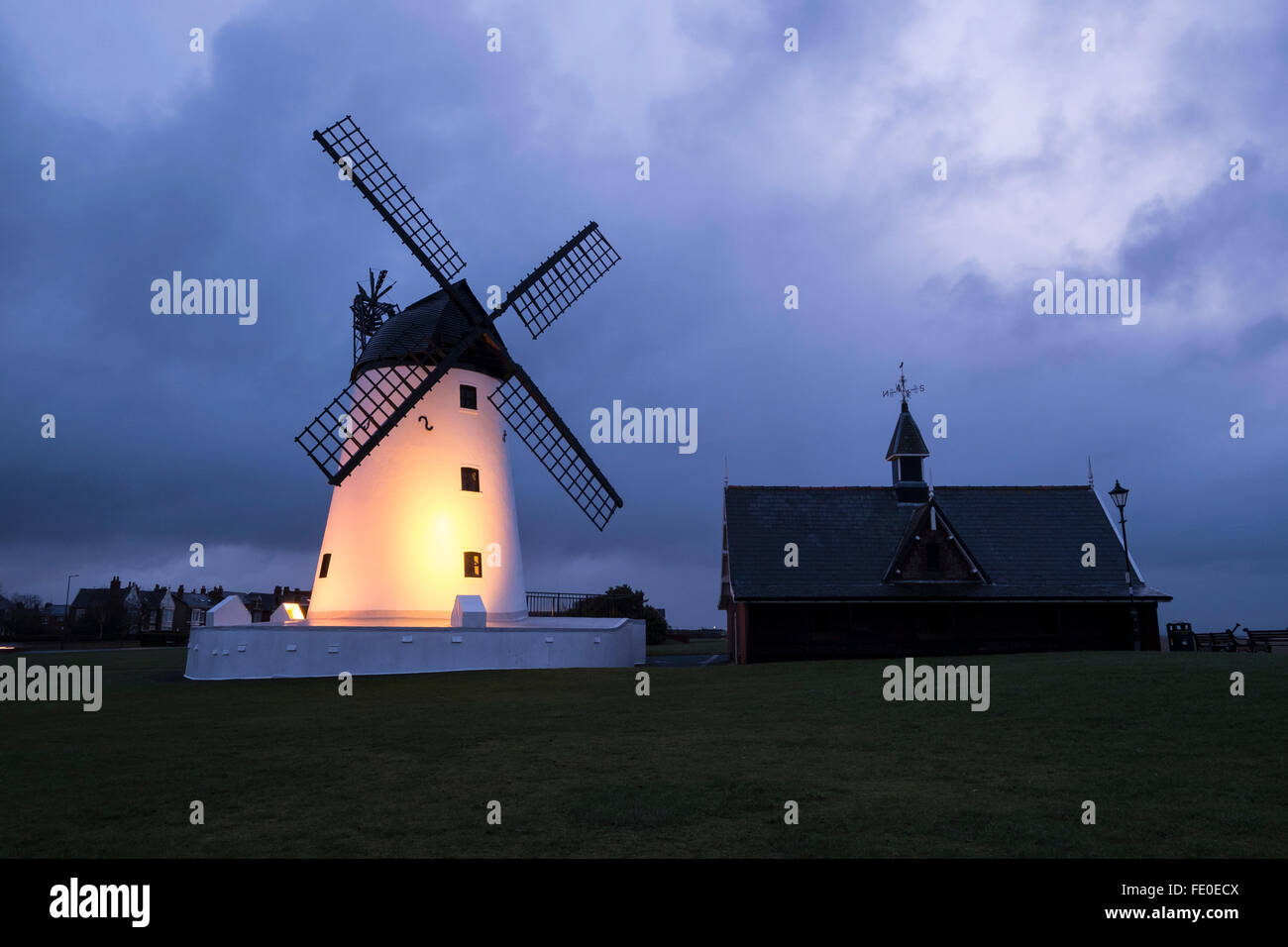 Lytham, Lancashire, UK. Windmill illuminated at dawn on the Fylde Coast ...