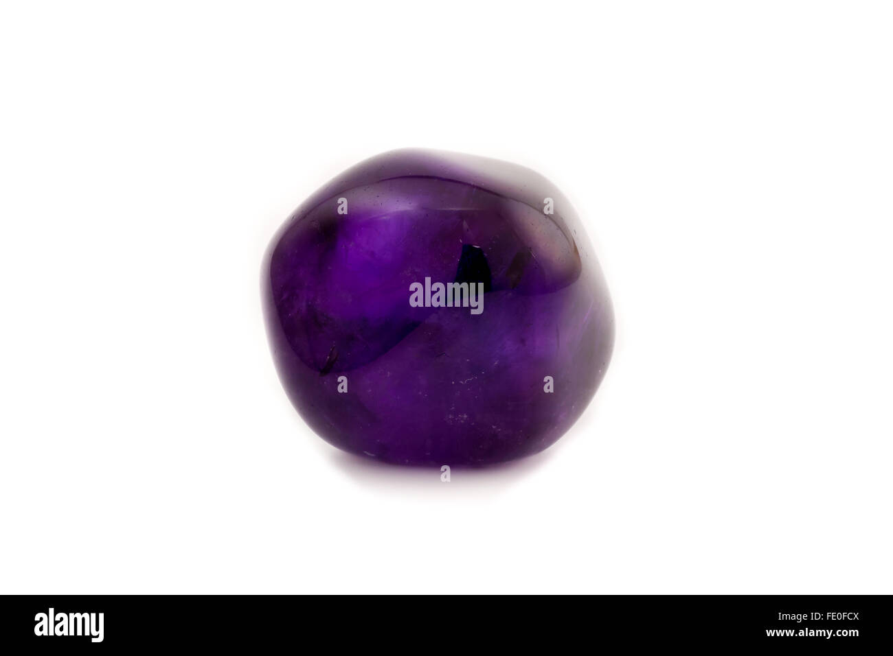 Beautiful purple/violet amethyst gemstone on a white background Stock ...