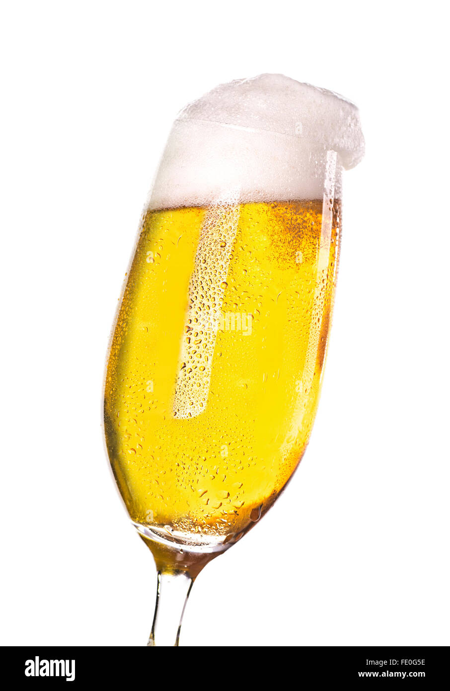 A glass of beer with foam crown Stock Photo - Alamy