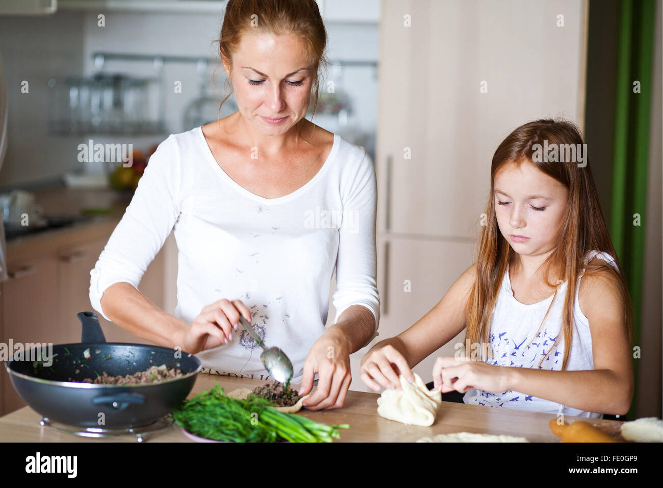 family preparing meals, dinner and breakfast Stock Photo - Alamy