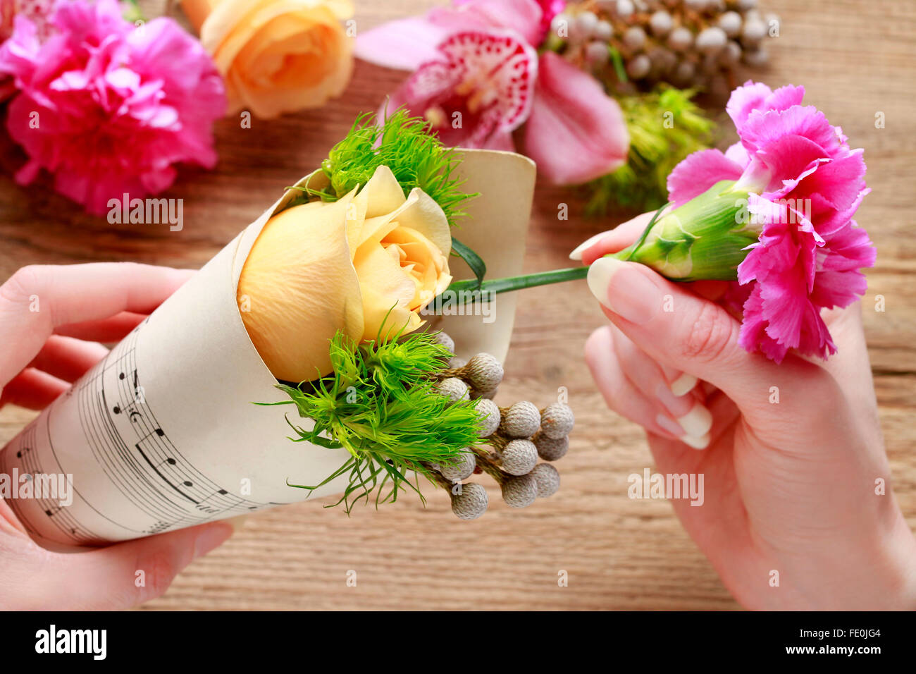 Flower cornets with roses, carnation and brunia Stock Photo - Alamy