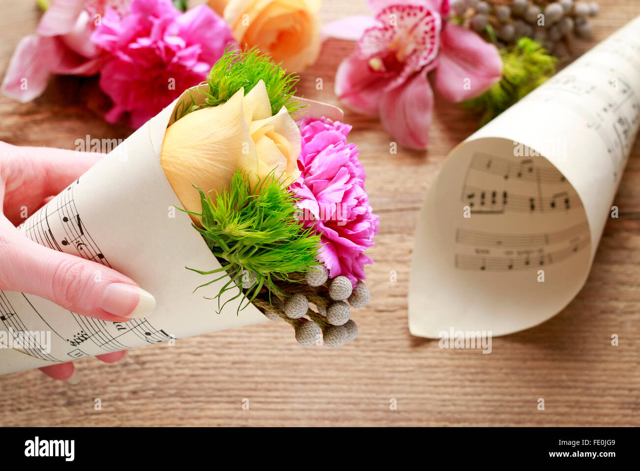 Flower cornets with roses, carnation and brunia Stock Photo - Alamy