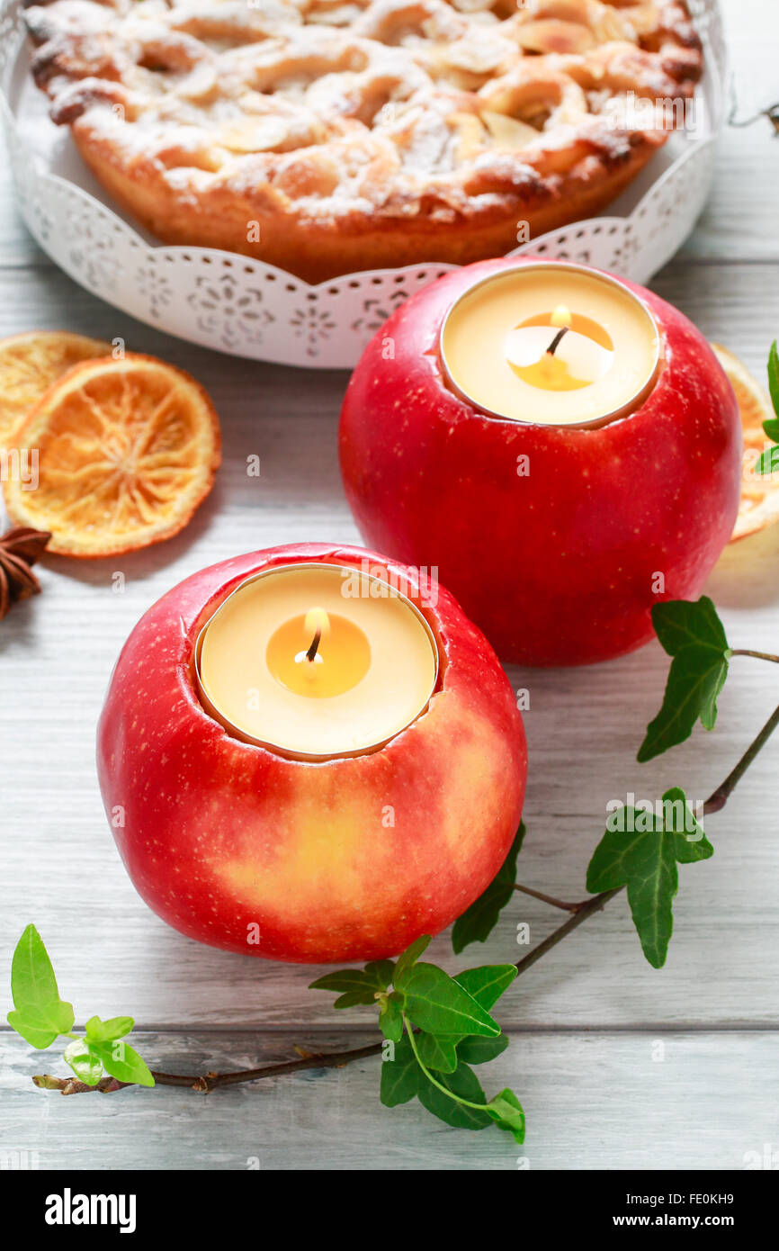 Red apples with candles inside. Simple Christmas decorations Stock ...