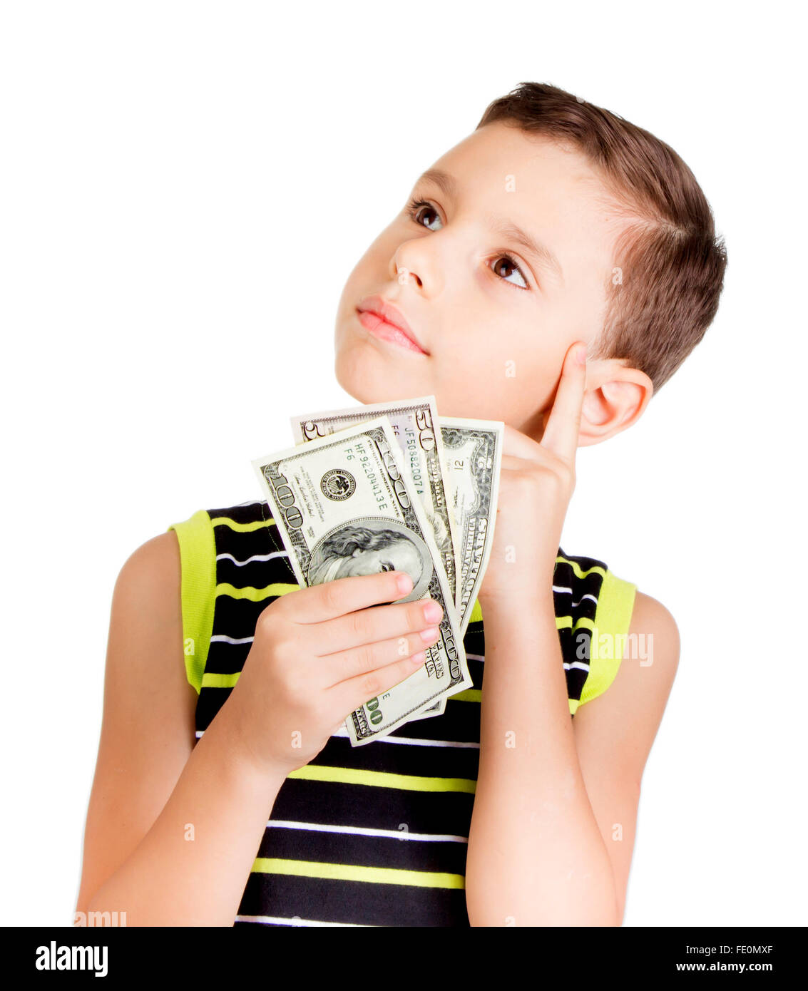 Young boy thinking what to buy money Stock Photo - Alamy