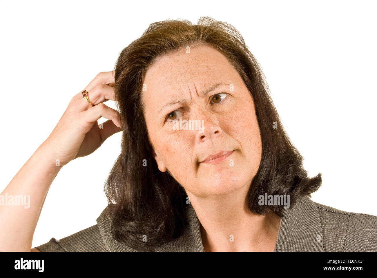 Mature Woman Scratching Head While Thinking Stock Photo - Alamy
