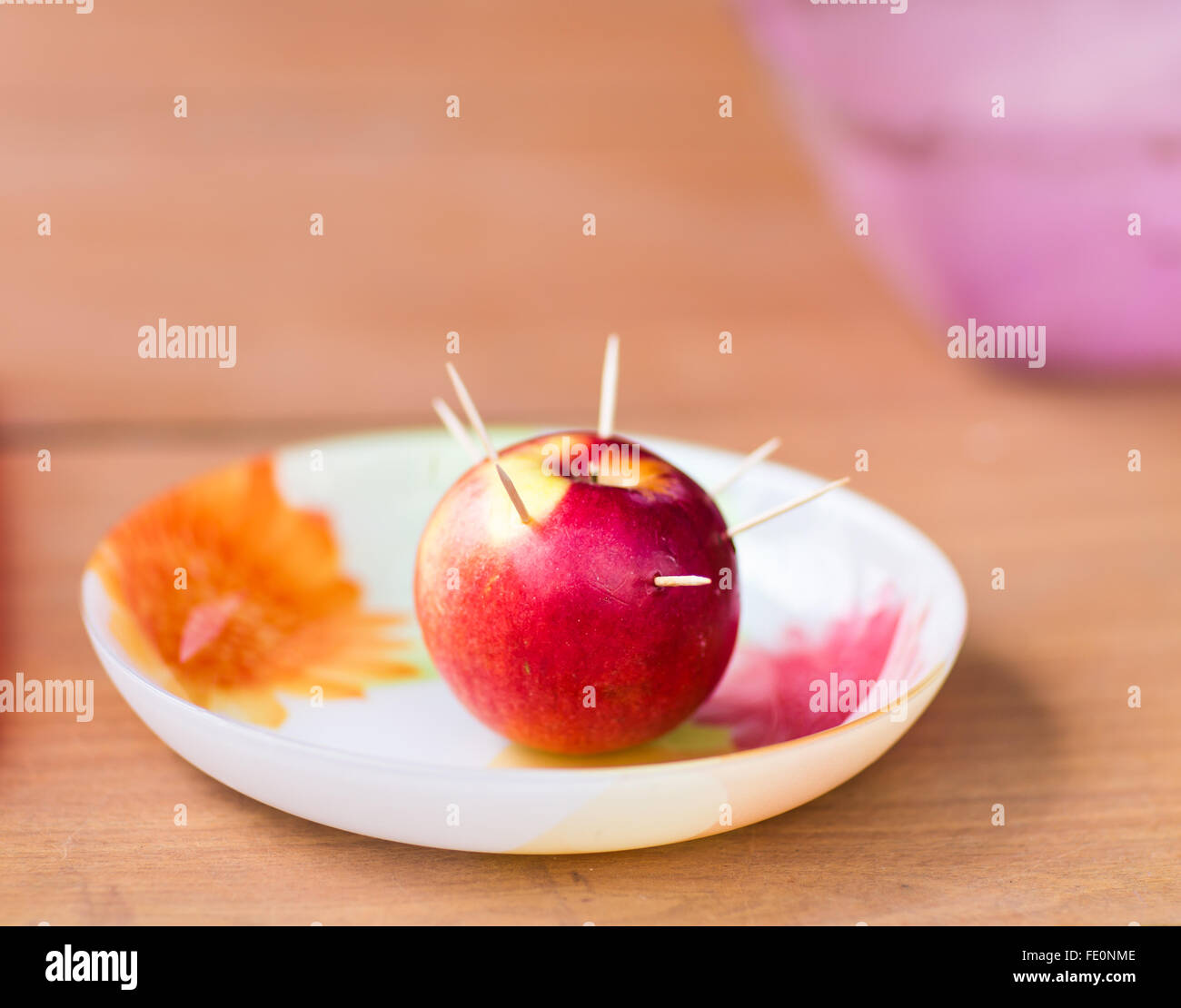 toothpicks stab into red apple Stock Photo - Alamy