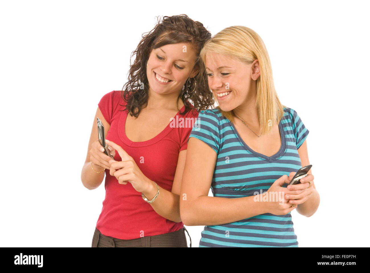 Two Female Teenagers Sharing Text Messages Stock Photo - Alamy