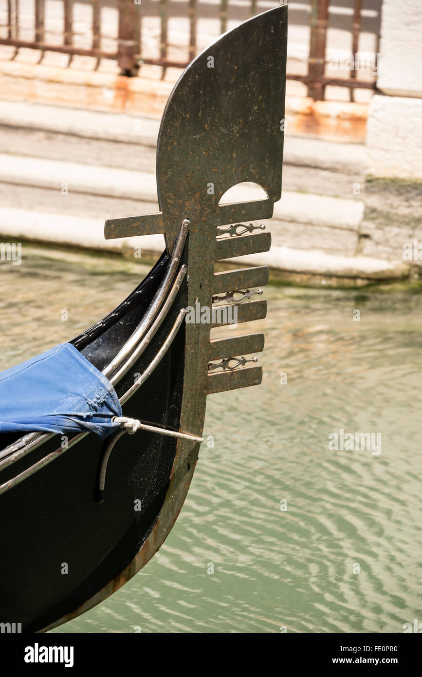 The shiny metal fork at the front of a gondola in Venice has a special ...