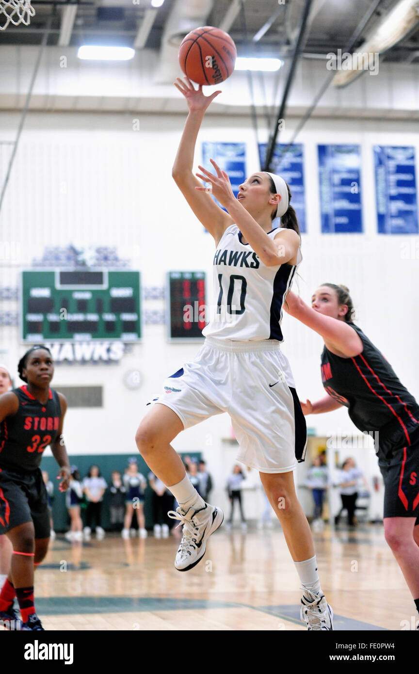 Exploiting an open route to the basket, a player converts the ...