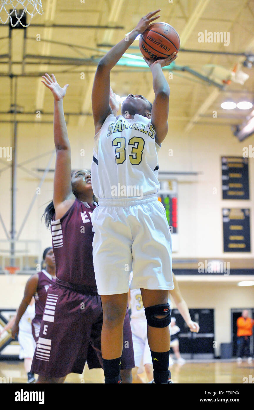 Player putting up an shot from under the basket during a high school ...