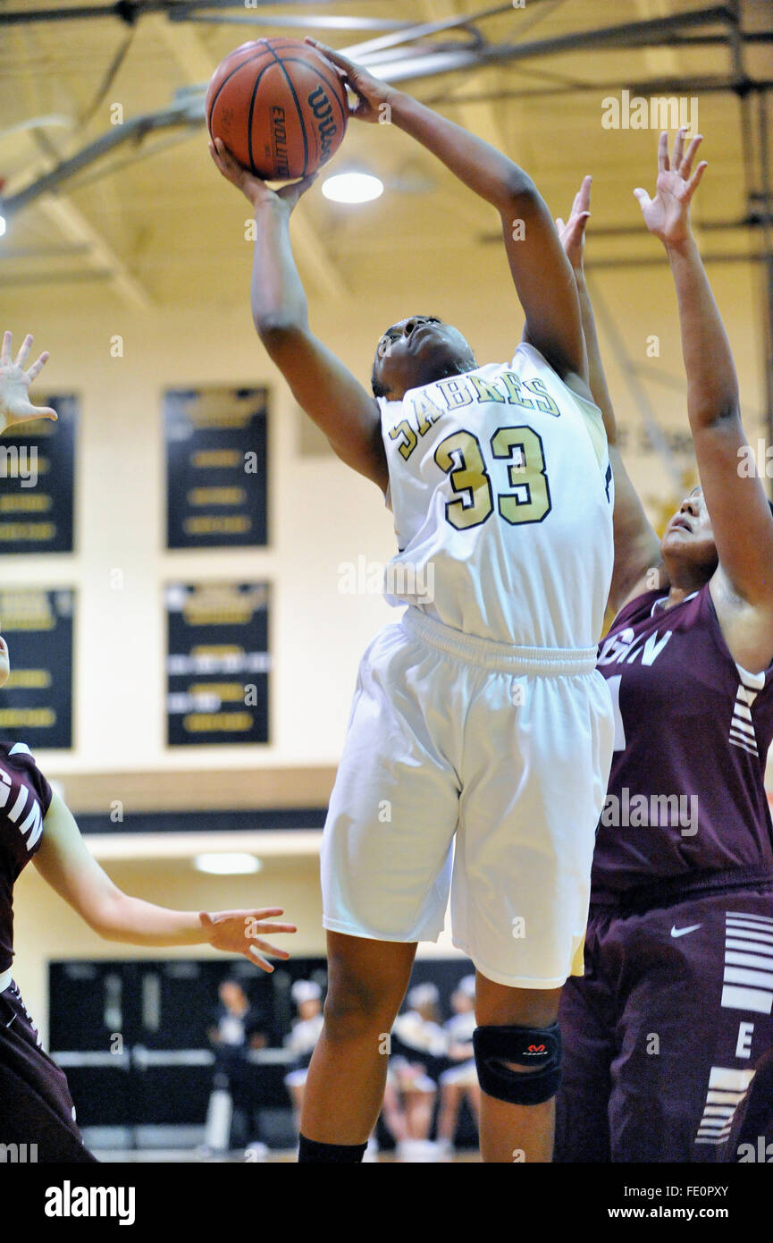 Player putting up an shot from under the basket during a high school ...