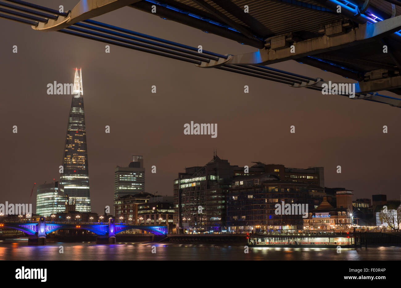 Night shot of the Shard building and city skyline in London, England ...