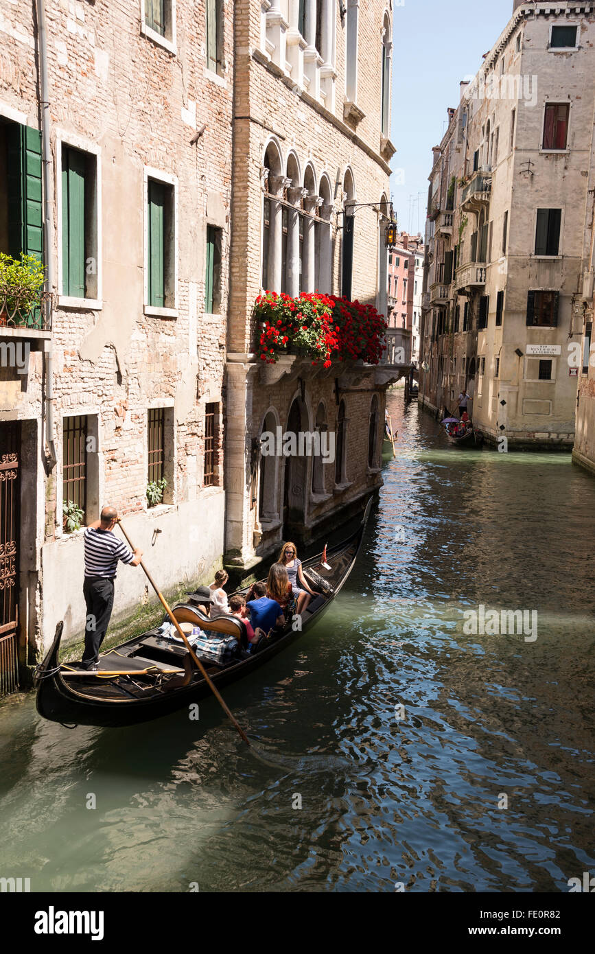 A gondola makes its way along the Rio de S.Luca, one of the many inland ...