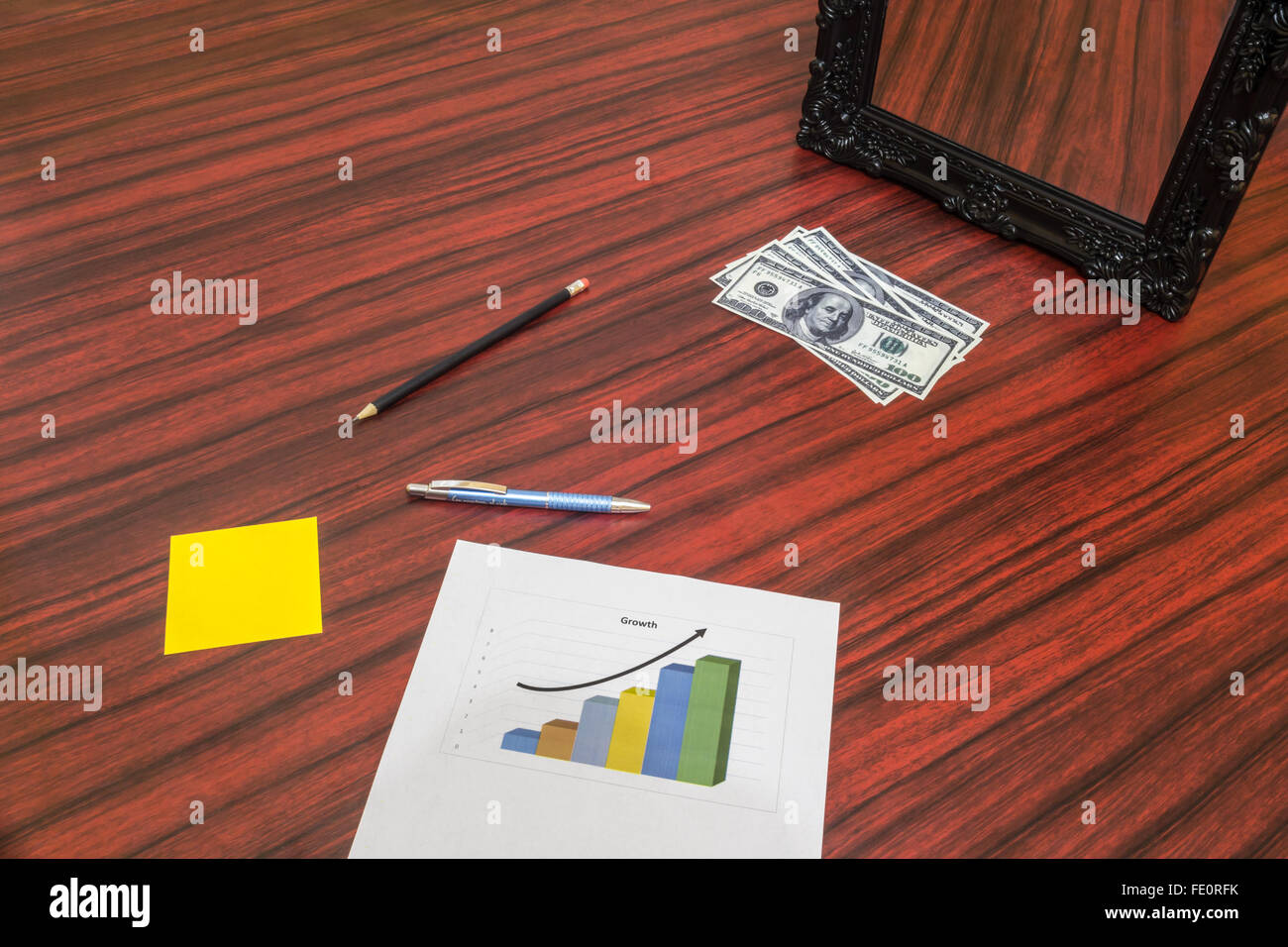 Money without reflection in front of a mirror. Both objects are ...
