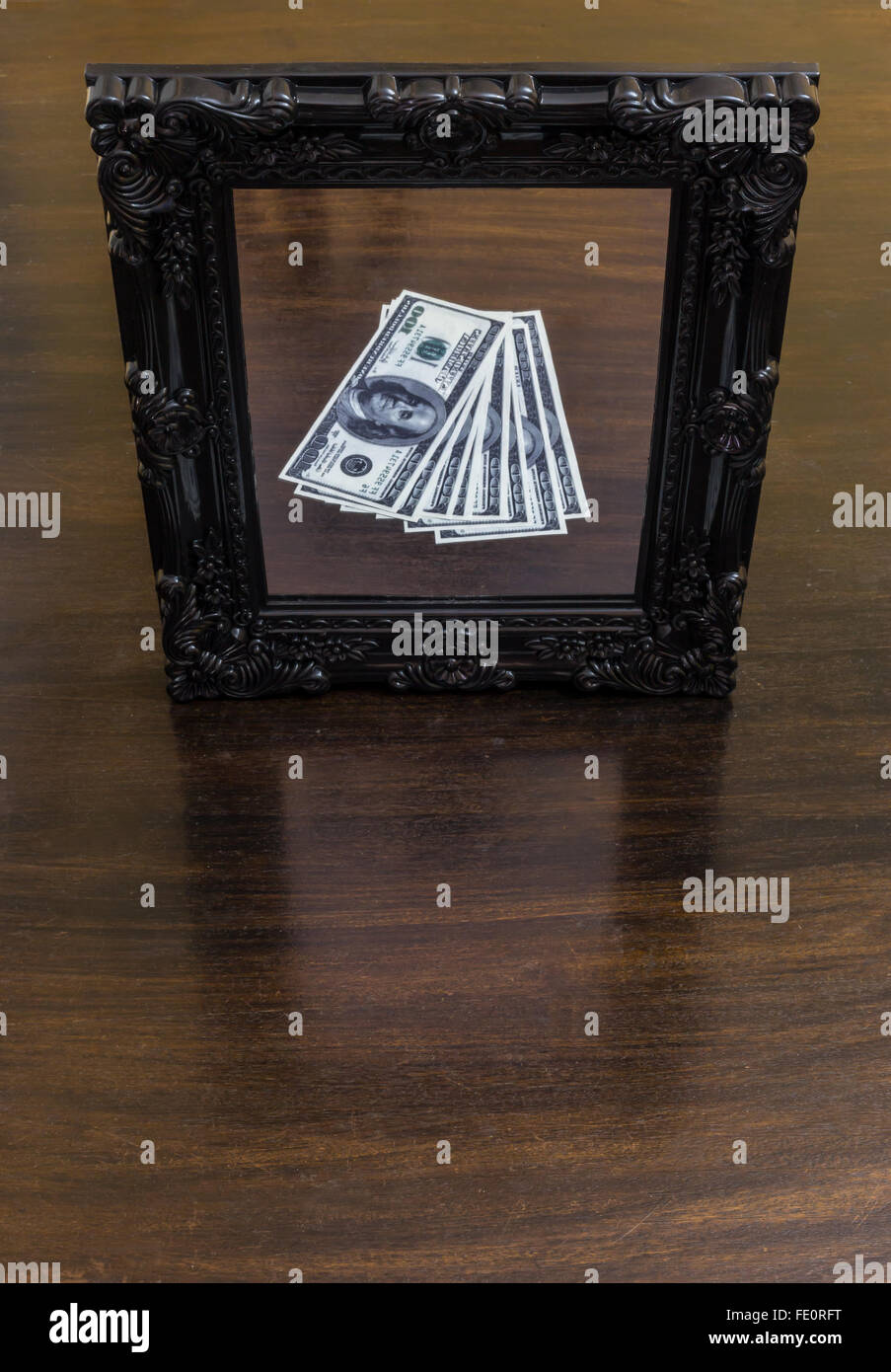 Reflection money in mirror objects hi-res stock photography and images ...