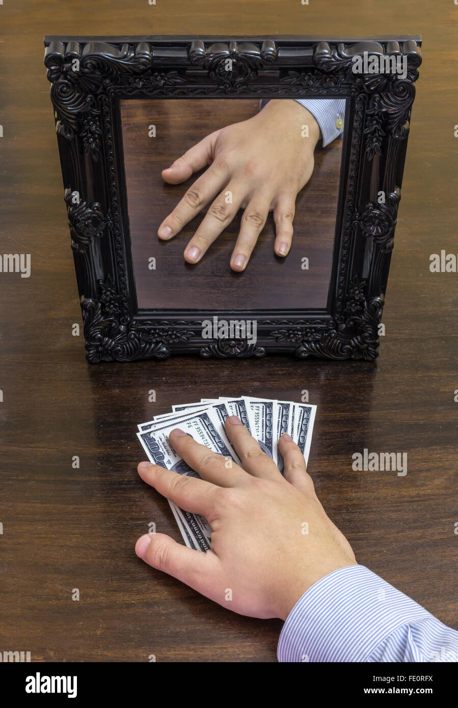Human hand holding money without reflection in the mirror Stock Photo ...