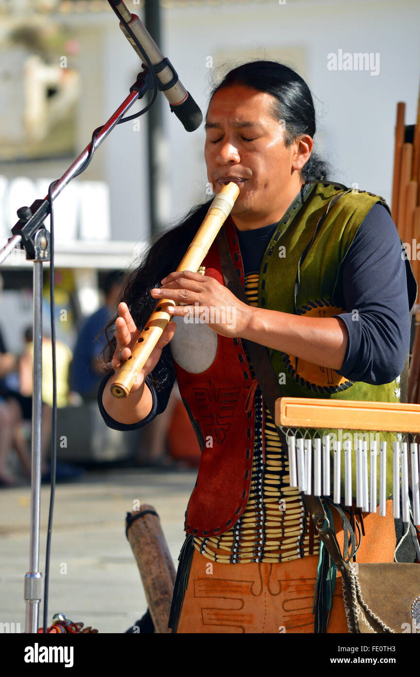 Old man playing flute in hi-res stock photography and images - Alamy