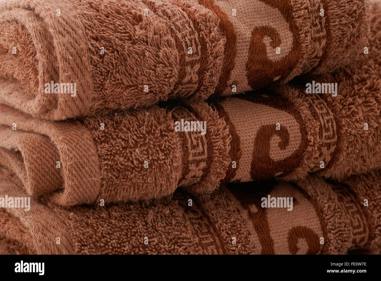 stack of brown towels with texture Stock Photo - Alamy