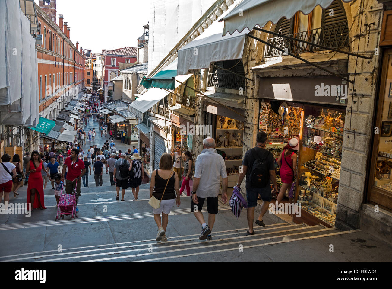Tourists on the steps with small tourist shops on either side of the ...