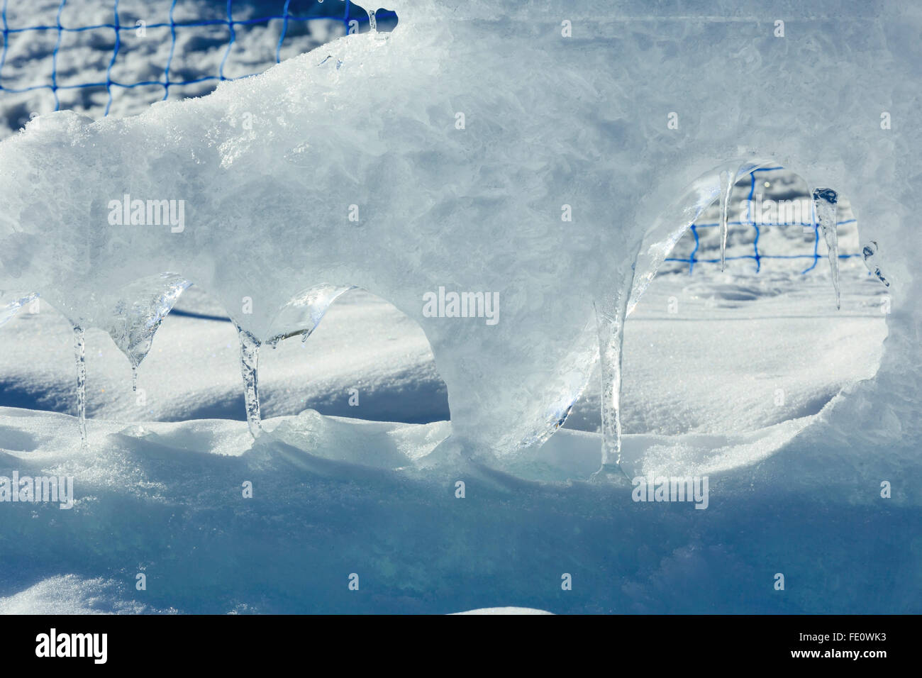 Melting glacial block of ice with icicles closeup Stock Photo - Alamy