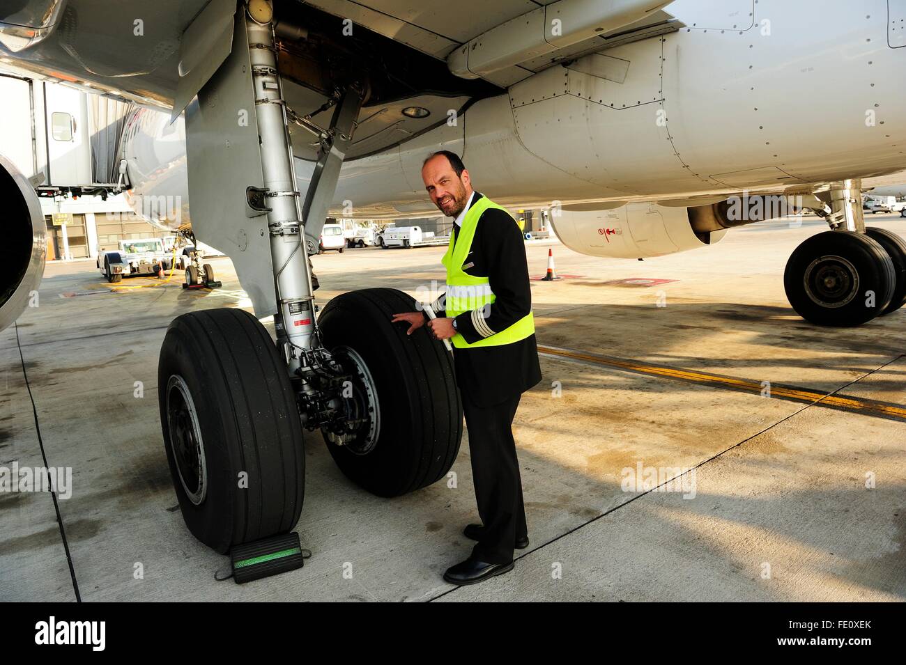Pilot checking tyres and undercarriage, passenger aircraft, Airbus A321 ...