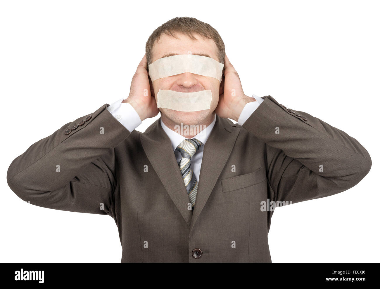 Businessman with tape over his eyes and mouth Stock Photo - Alamy