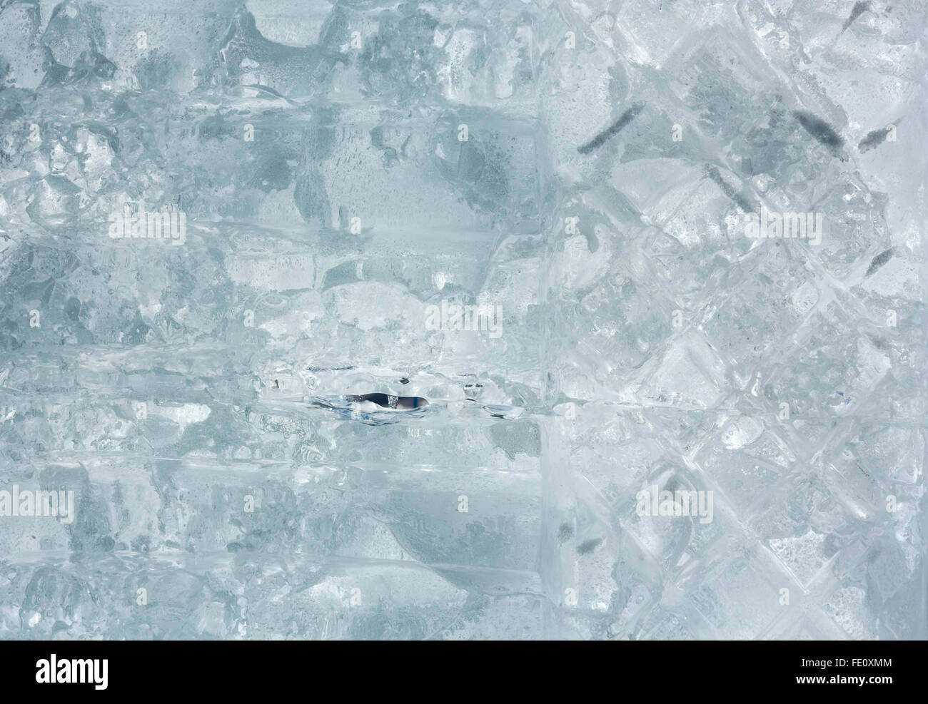 Glacial block of ice with interesting structure closeup . Winter ...