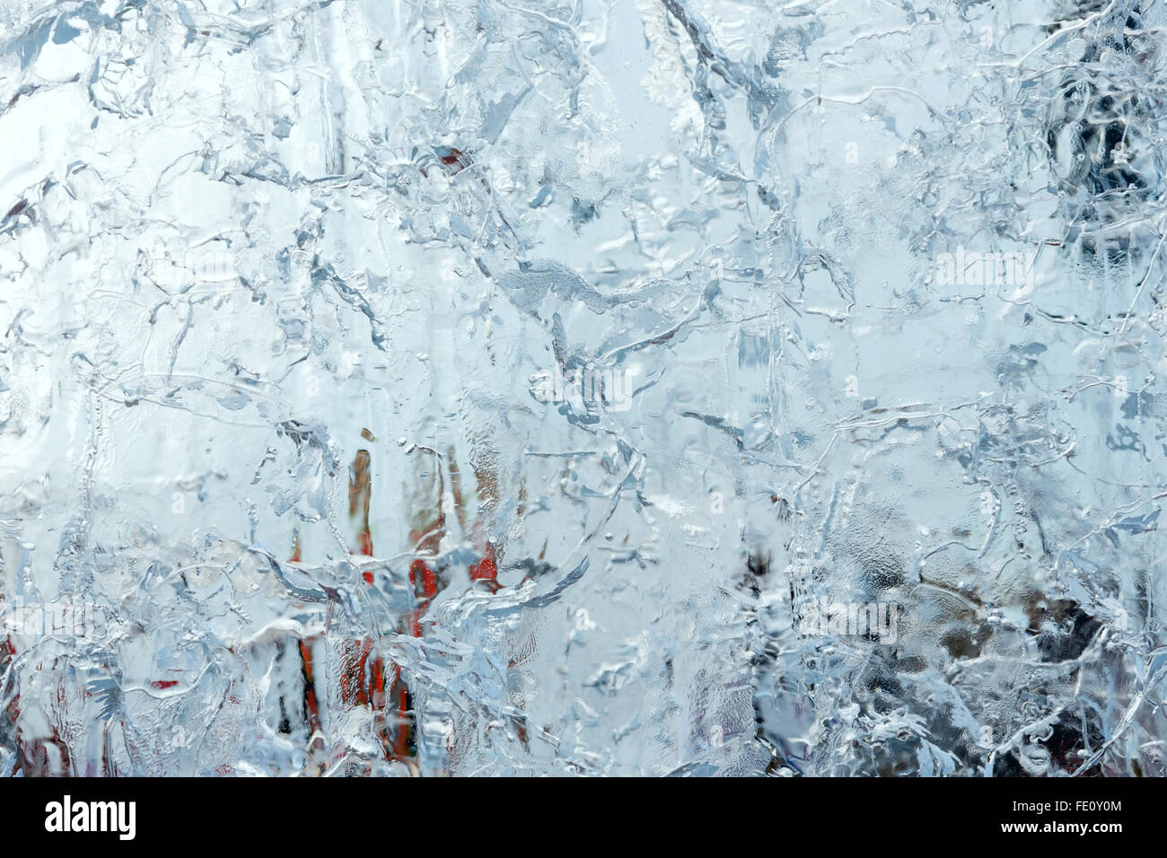 Glacial transparent wall of ice with interesting drawings and patterns ...