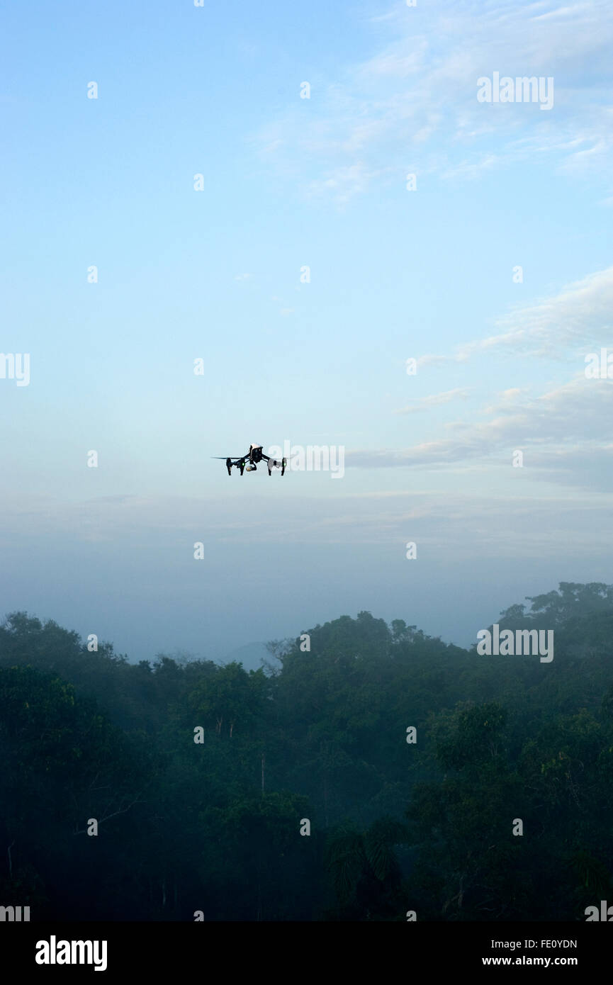 Drone flying over forest Stock Photo - Alamy