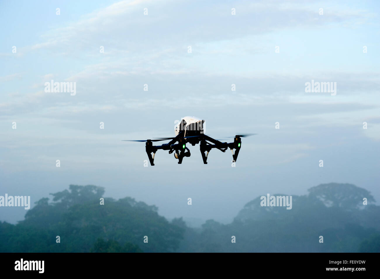 Drone flying over forest Stock Photo - Alamy