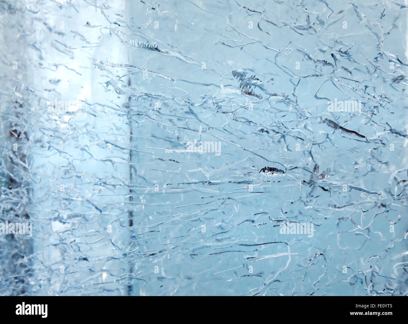 Glacial transparent wall of ice with interesting drawings and patterns ...