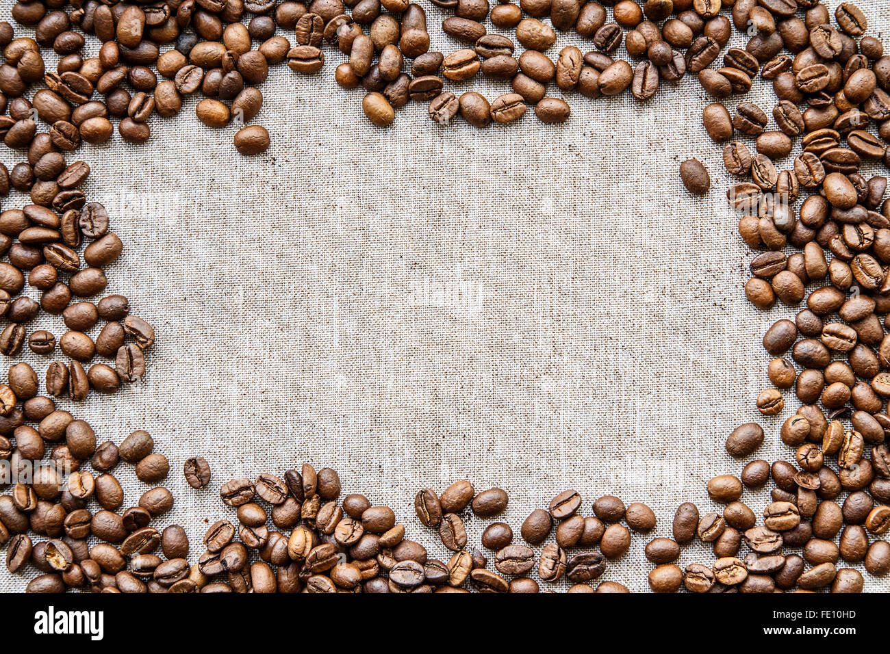 coffee beans on texture canvas Stock Photo - Alamy