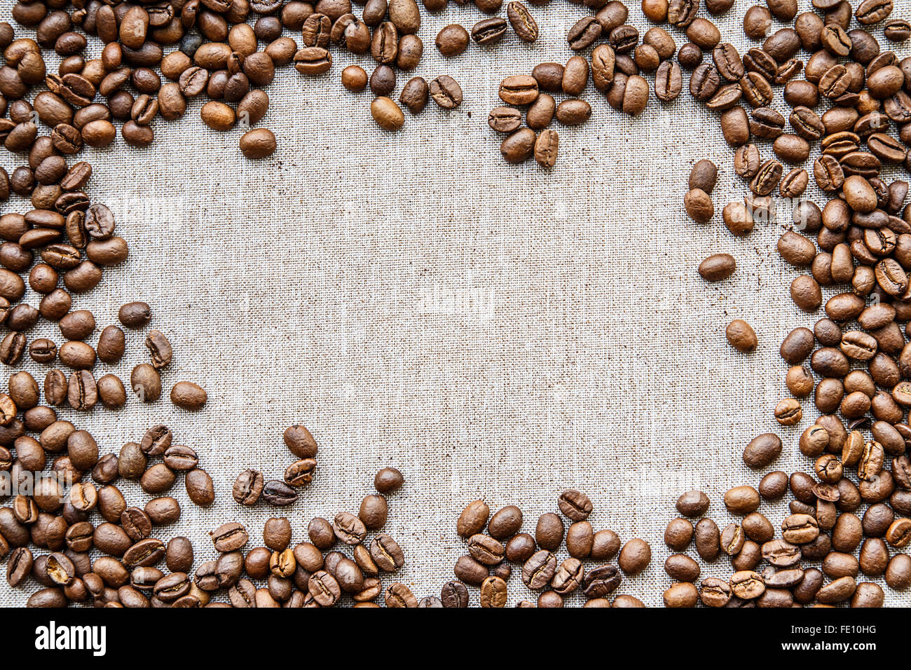 coffee beans on texture canvas Stock Photo - Alamy