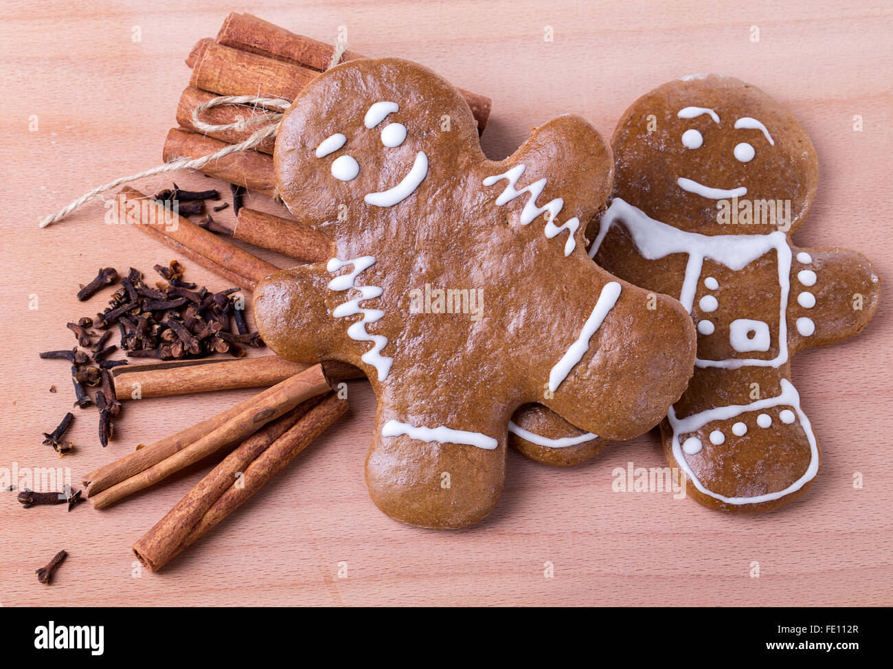 man cinnamon spice cookies wood background Stock Photo - Alamy