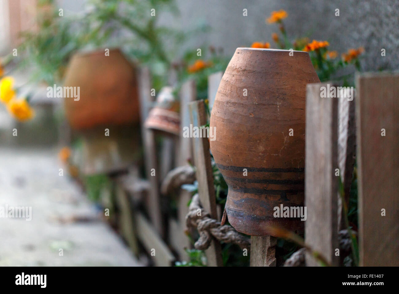 fence clay pot day outside Stock Photo - Alamy