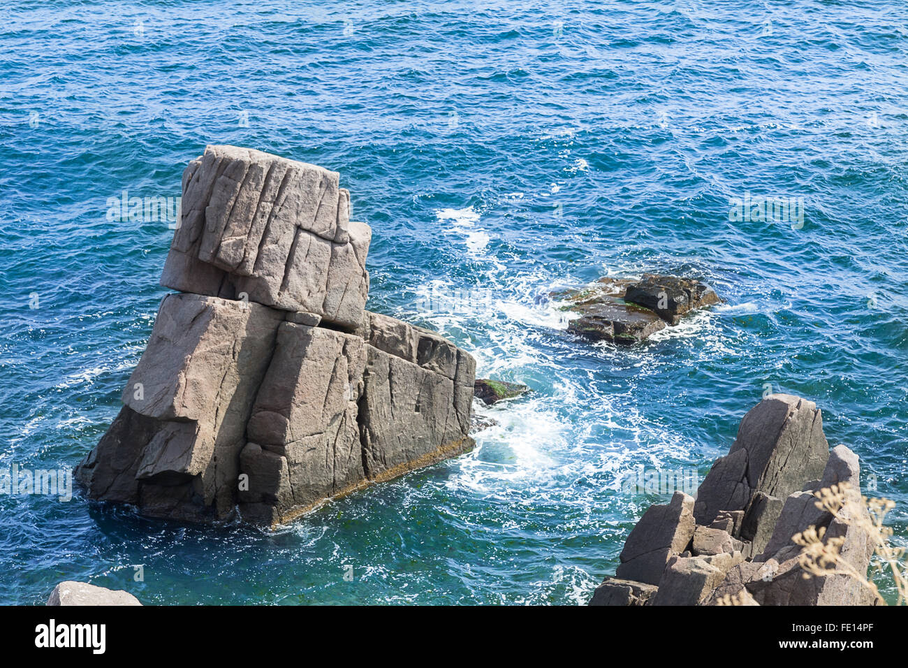 blue Sea shore rocks stones Stock Photo - Alamy
