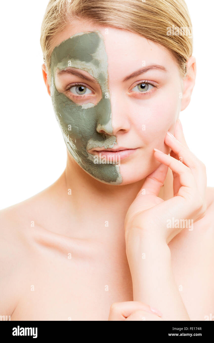 Skin care. Woman in clay mud mask on face isolated on white. Girl ...