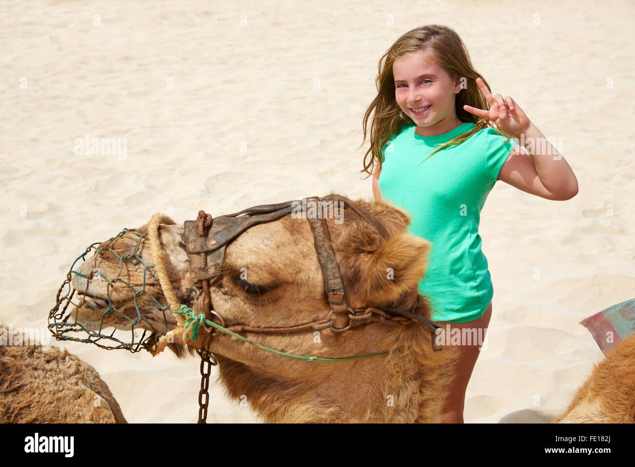 Child Girl Riding Camel In High Resolution Stock Photography and Images ...