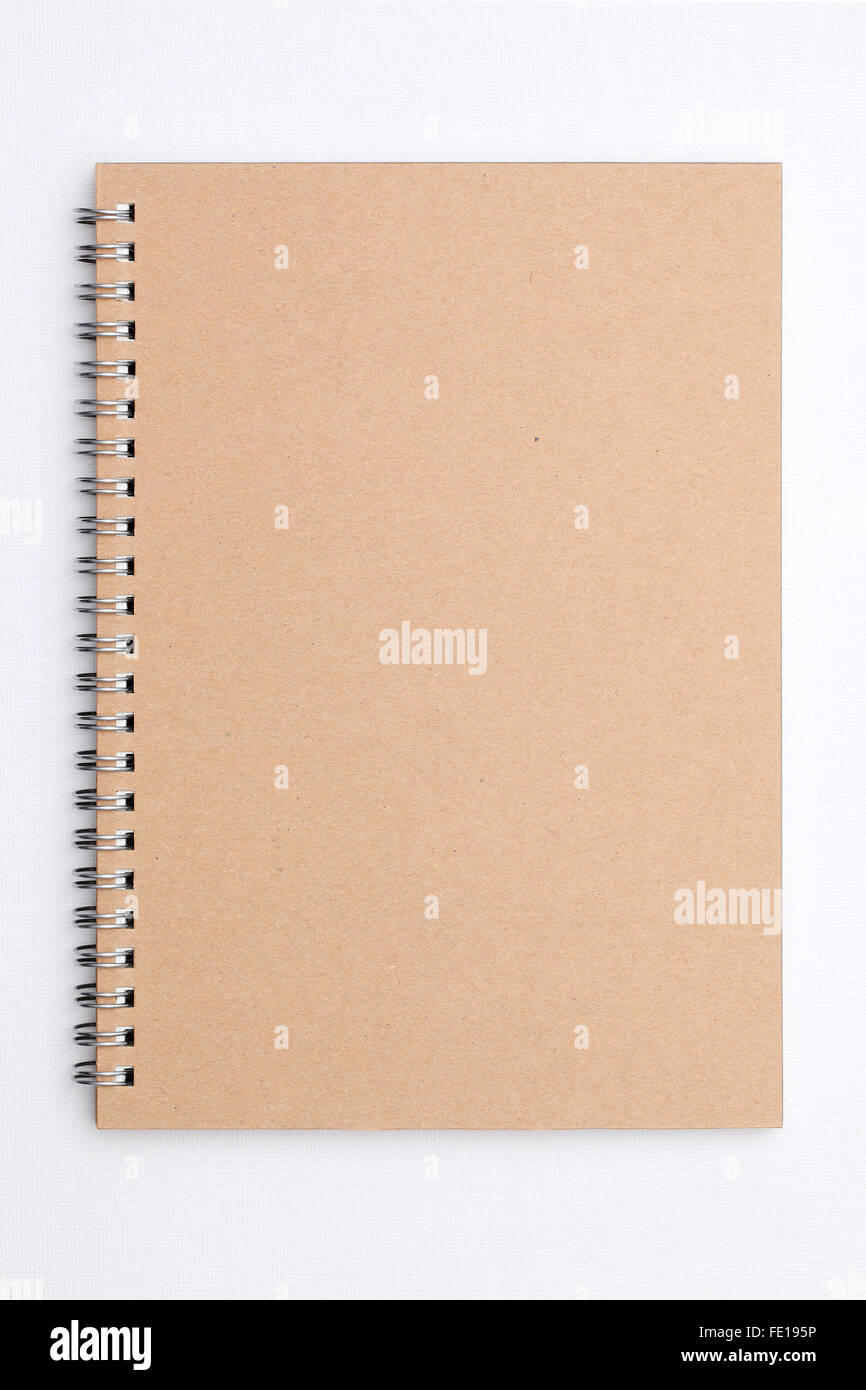 spiral brown notebook on white background Stock Photo - Alamy