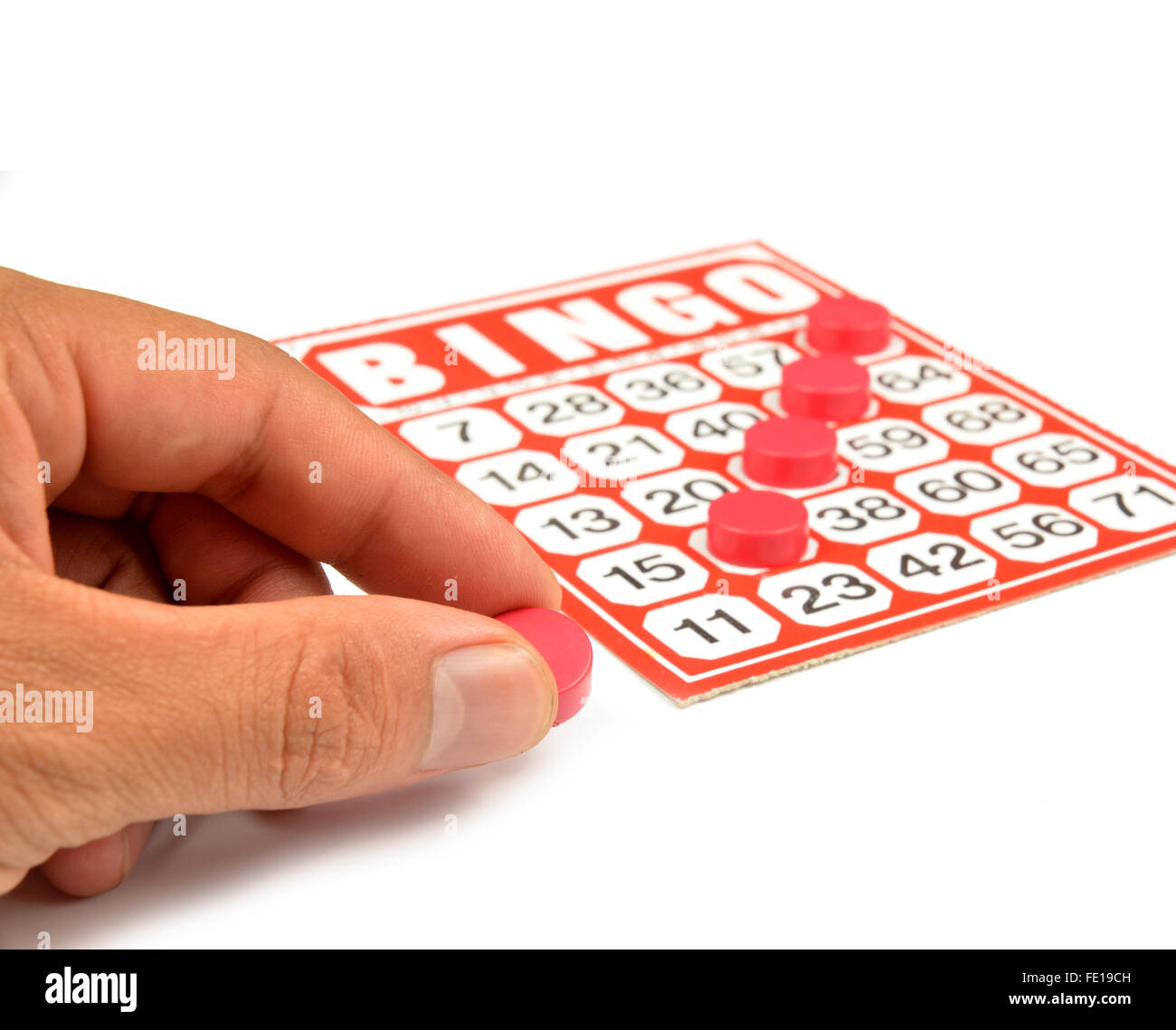 bingo card with hand hold winning chips Stock Photo - Alamy